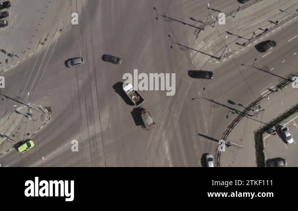 A large urban intersection with car traffic - top view on a hot day ...