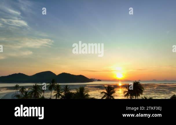 Amazing sandy beach in golden sunrise.A sandbar stretches down into the ...