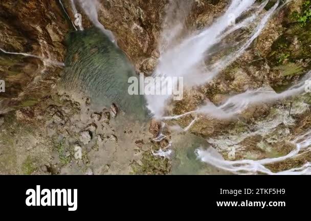 Aerial top view flying drone shooting beautiful waterfalls falling ...