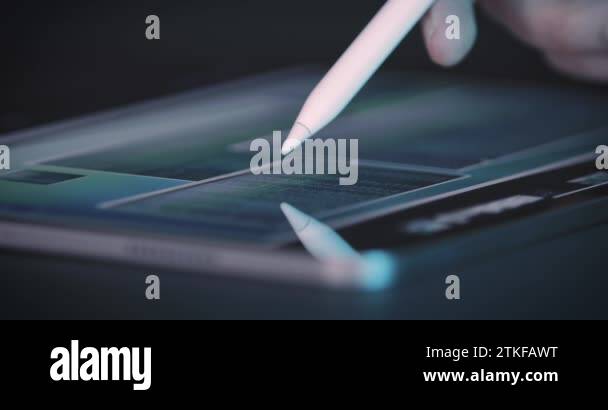 Stylus is used to move around the tablet screen with windows and lines of code. Concept Hacker ...