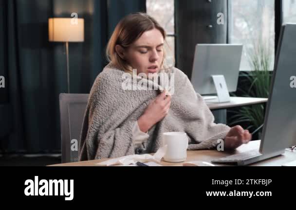 Sick upset young woman blowing running nose got flu while working from ...