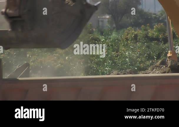 Excavator crane moving earth loading truck. Construction Stock Video ...