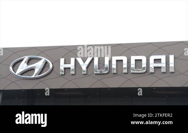 hyundai silver logo sign writing caption text on gray dealership front ...