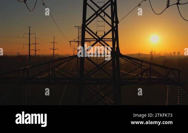 High voltage electric towers at golden hour sunset. Transmission power ...