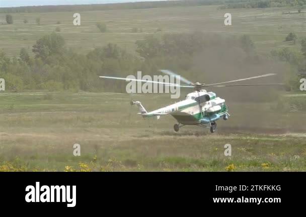 Wind shot Special force soldiers exit from a helicopter at battlefield ...