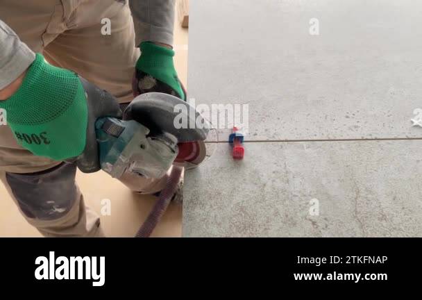 4k video footage of taking measurements for further cutting tiles using ...