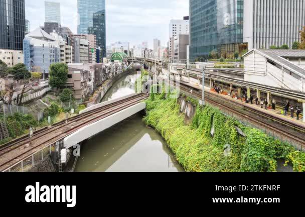 Time lapse of Japanese railway subway train on crossing railroad tracks ...