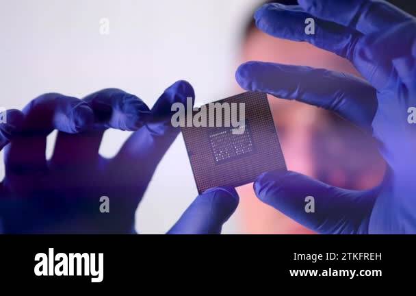 Futuristic Technology Concept: Engineer in Sterile Coverall Holds ...