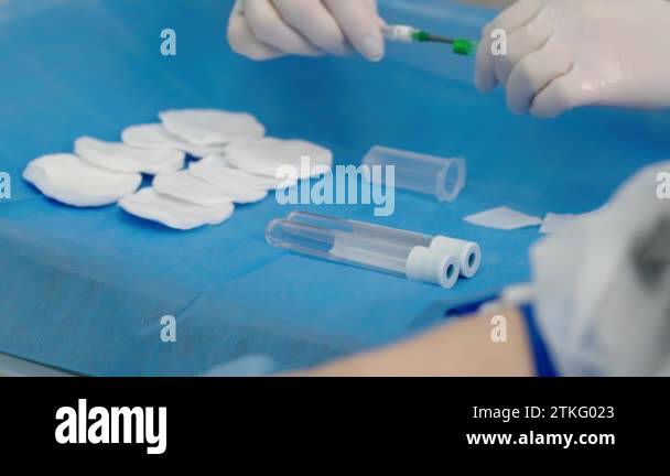 Laboratory worker doctor takes a blood sample for analysis, hand ...