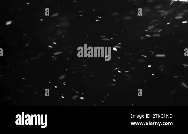 Snow is falling sideways in strong wind in cold winter season on black ...