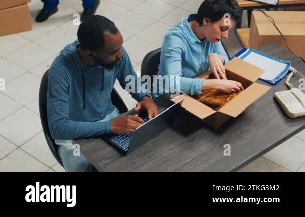 Man and woman preparing shipment order with merchandise from warehouse ...