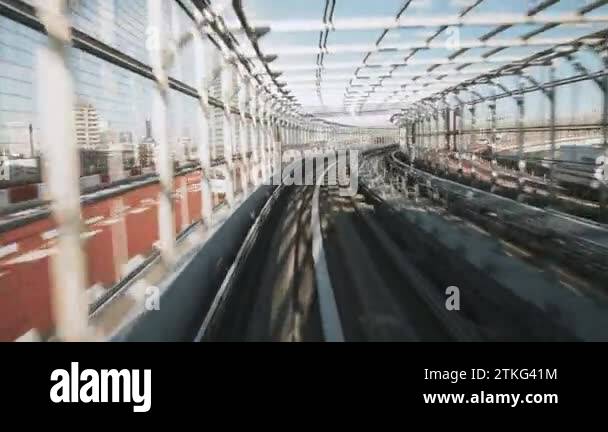 Point of view Yurikamome line automated train moving forward crossing ...