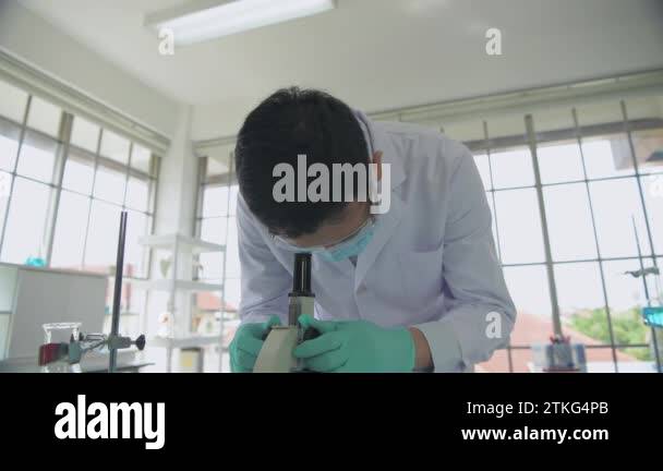 Research concept of 4k resolution. Asian scientists are examining the ...