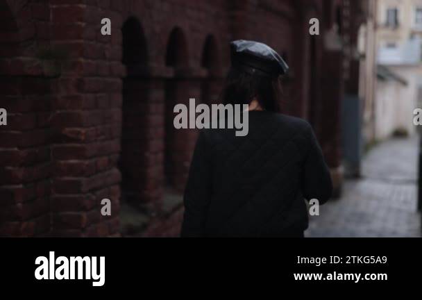 turning around, looking at camera, woman walking. Beautiful woman ...