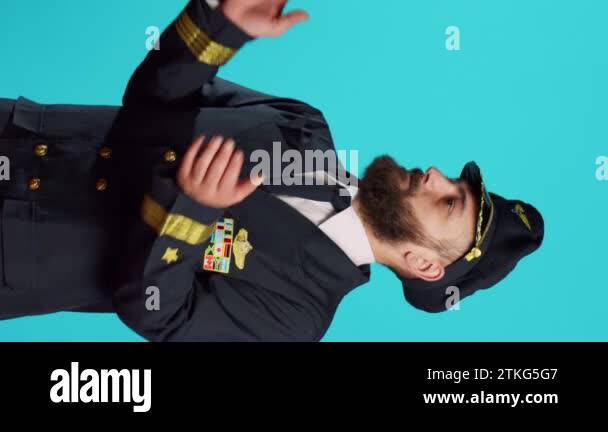 Vertical video: Male aviator applauding and cheering on camera, saying ...