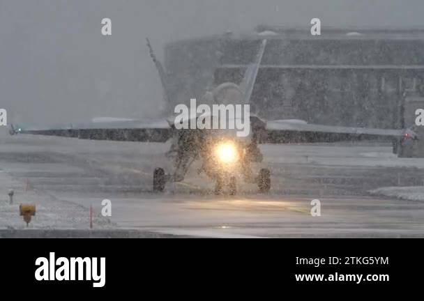Military pilot rolls a supersonic fighter jet to take off during a ...