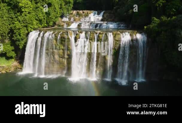 Tropical waterfalls surrounded by forest and jungle. Tinuy-an Falls in ...