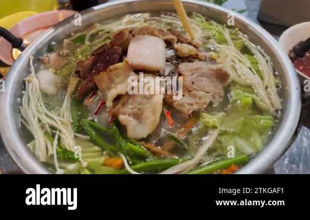 Moo Kratha is a popular Thai dish that features beef, pork, vegetables ...