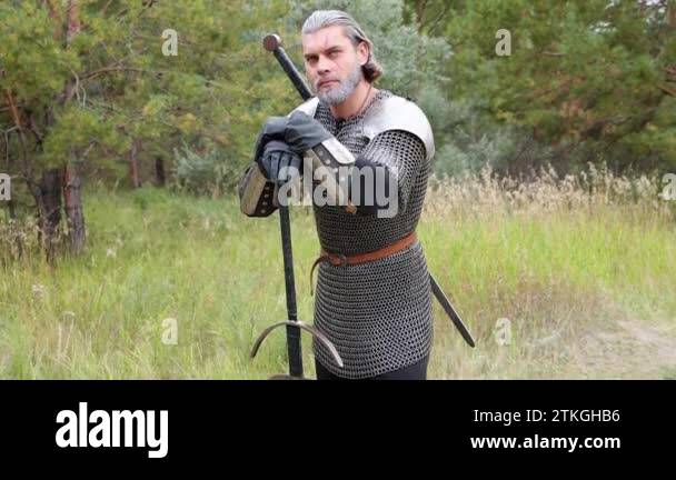 Portrait of a medieval warrior with gray hair and a scar on his face in ...