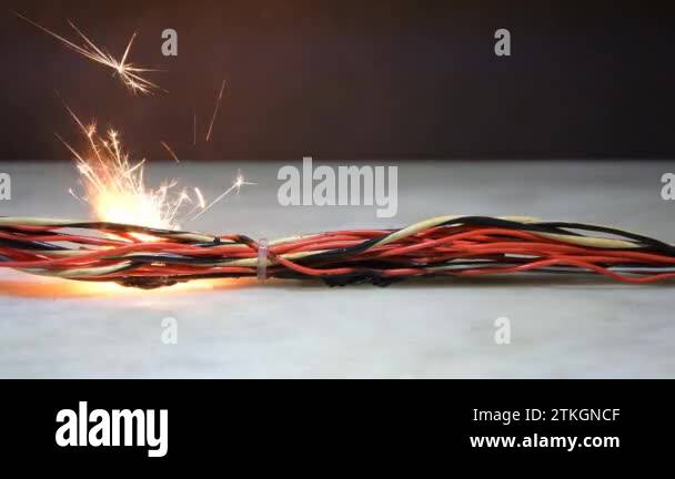 Electrical wiring and wires are highlighted on a dark background. A ...