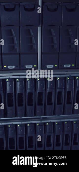 Vertical video of a large computer server room in a data center with blinking lights Stock Video ...