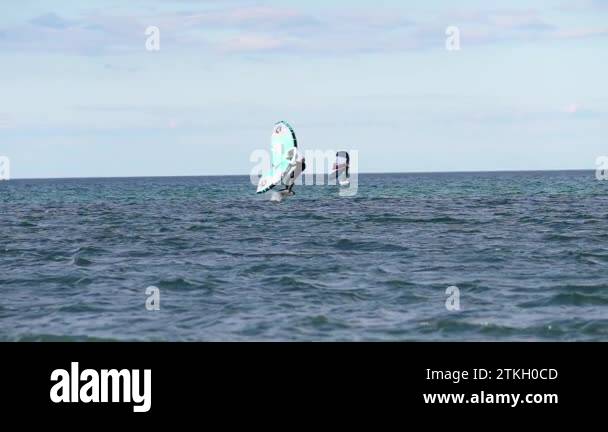 Modern water sport. Hydrofoil ride on the ocean using the wing and the ...