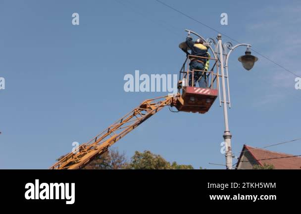 light bulb, pole lamp, equipment installs. Street light repair work ...