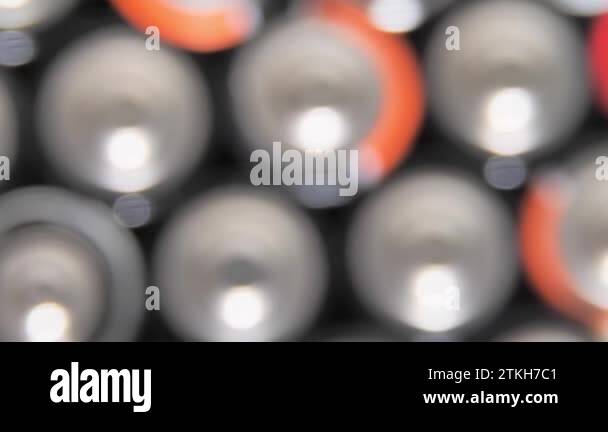 Different types of accumulators and batteries rotate on the turntable ...