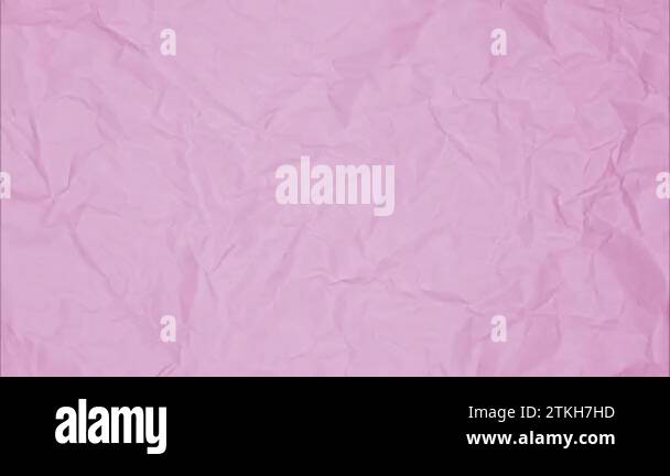 Video Top view of wrinkled textured light pink paper. Lilac crumpled ...