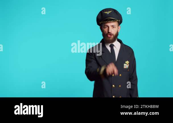 Airplane pilot in uniform pointing at camera and choosing, saying i ...