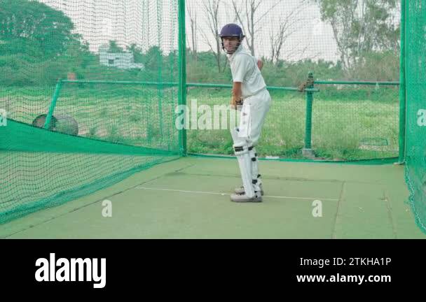 Cricket player doing warmup before the match starts in nets. Cricket ...