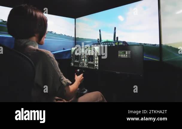 Rear view of caucasian woman having fun and playing in flight simulator ...