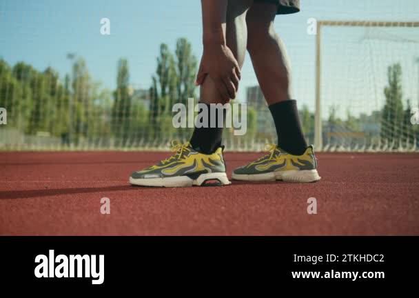 Cropped view male legs African American unrecognizable man sportsman ...