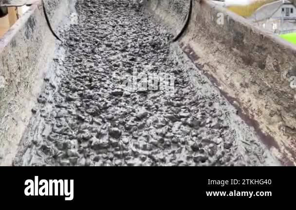 Pouring concrete mix on concreting formwork. Forming, an essential part ...