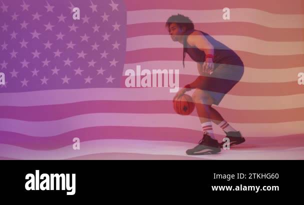 Animation of american flag over african american male basketball player ...