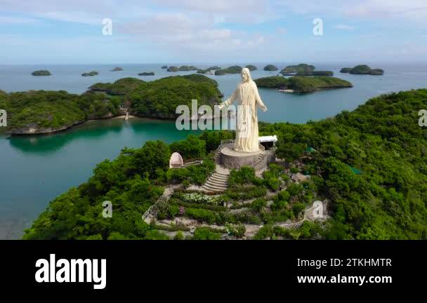 Aerial view of the hundred Islands national Park and the statue of ...