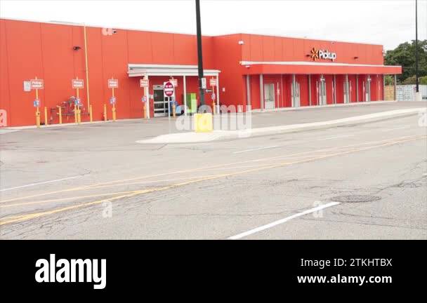 walmart pickup area orange building side of walmart with all empty ...