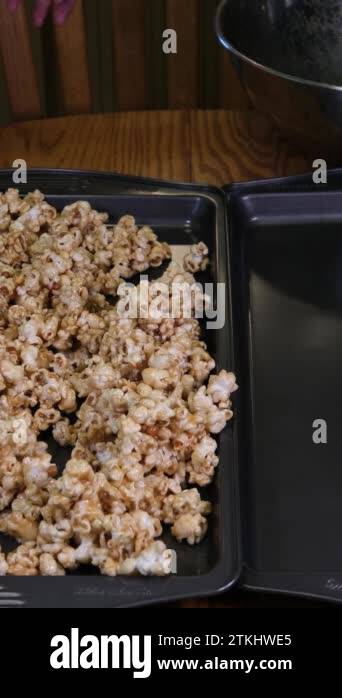 Cooking Popcorn popping on heated fry pan. Slow Motion. Making Popcorn ...