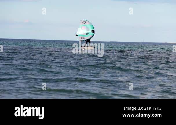 Modern water sport. Hydrofoil ride on the ocean using the wing and the ...