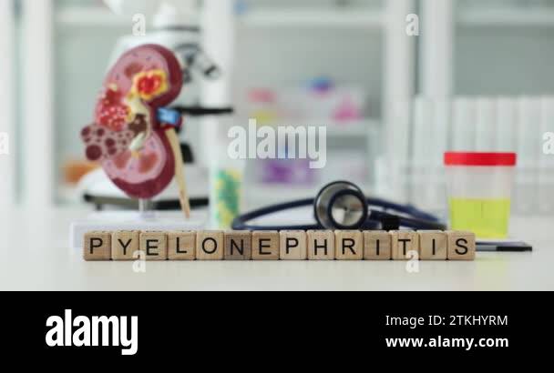 Word pyelonephritis on background of jar with urine analysis and ...