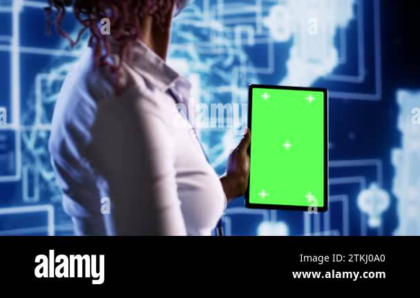 Admin In Data Center With Green Screen Tablet Using Artificial Intelligence Computing Simulating