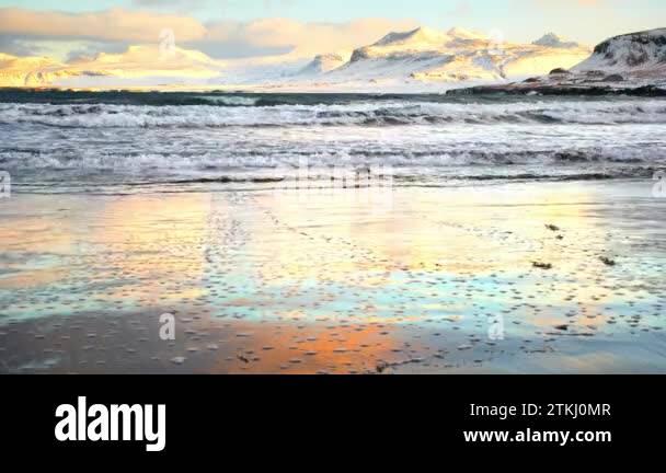 Icelandic Fjords During Sunset. Ocean Coast With Snow Covered Mountains ...
