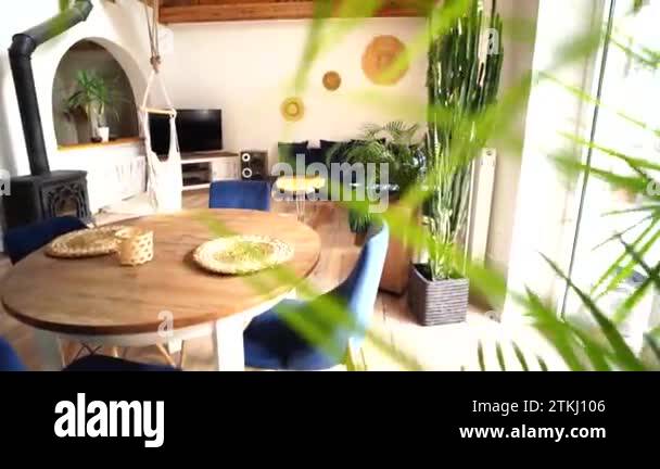 Real boho living room. Wall decoration with hats. Wooden high ceiling ...