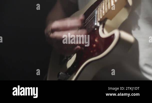 Real time handheld shot of crop anonymous male musician playing on ...