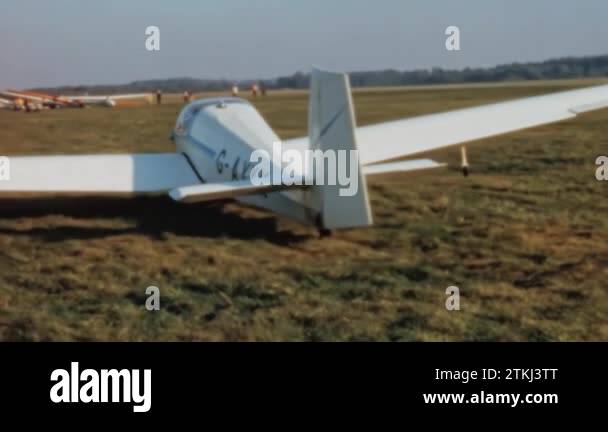 Vintage motor glider light aircraft takeoff run on a single central ...