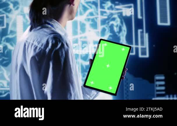 Skillful IT consultant using green screen tablet to implement artificial intelligence parallel ...