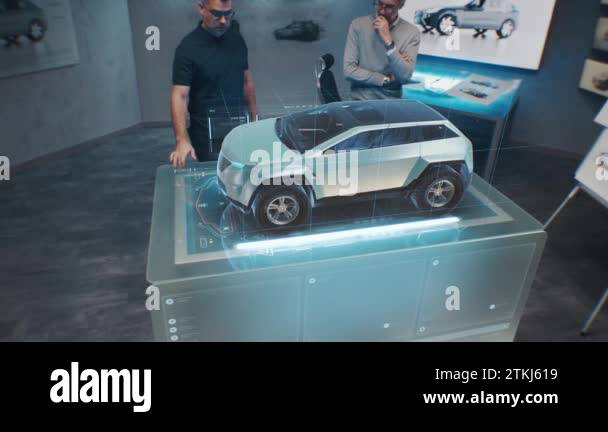 Two male automotive designers create body of new electric car using ...