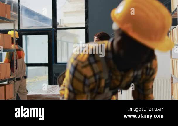 Workers team preparing goods shipment on shelves, working with ...