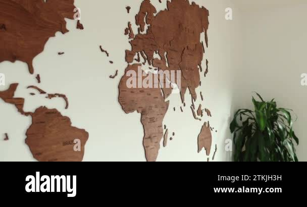 Wooden world map pan full view in modern room with white wall design ...