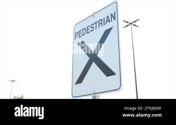 pedestrian x vertical rectangle sign in black writing on white ...